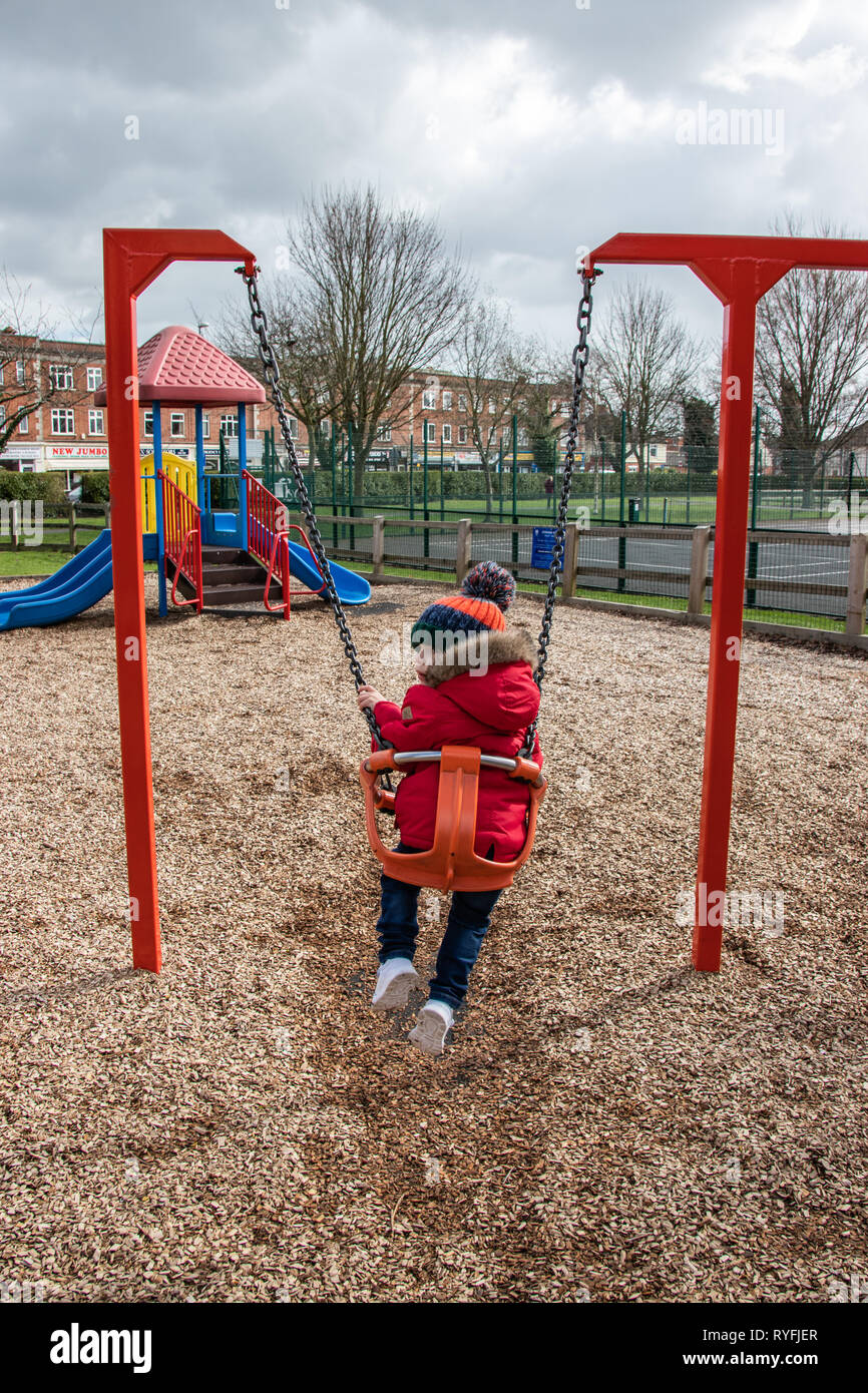 Children swings park playground hi-res stock photography and images - Alamy