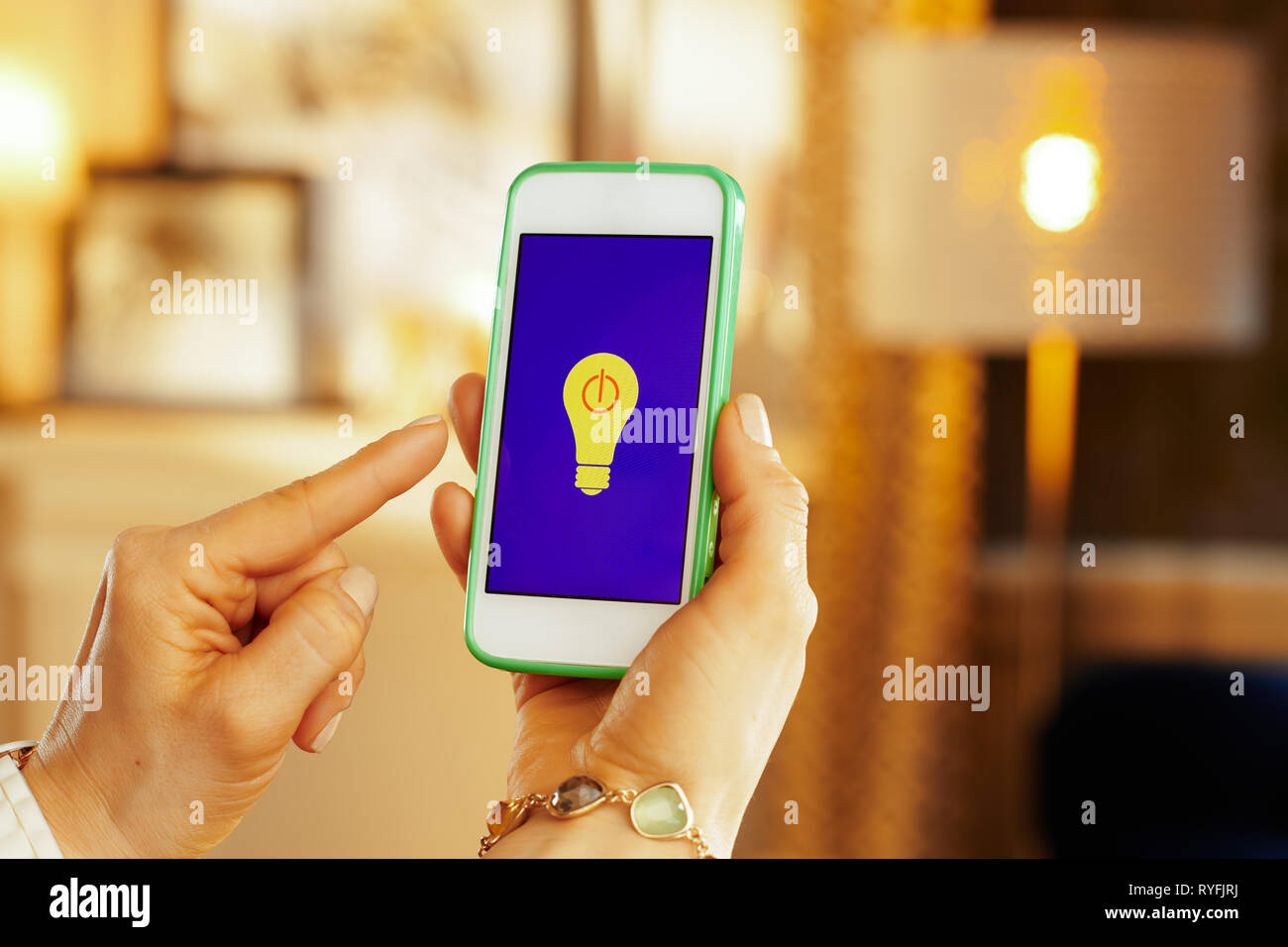 Closeup on smartphone with smart home application controlling smart ...