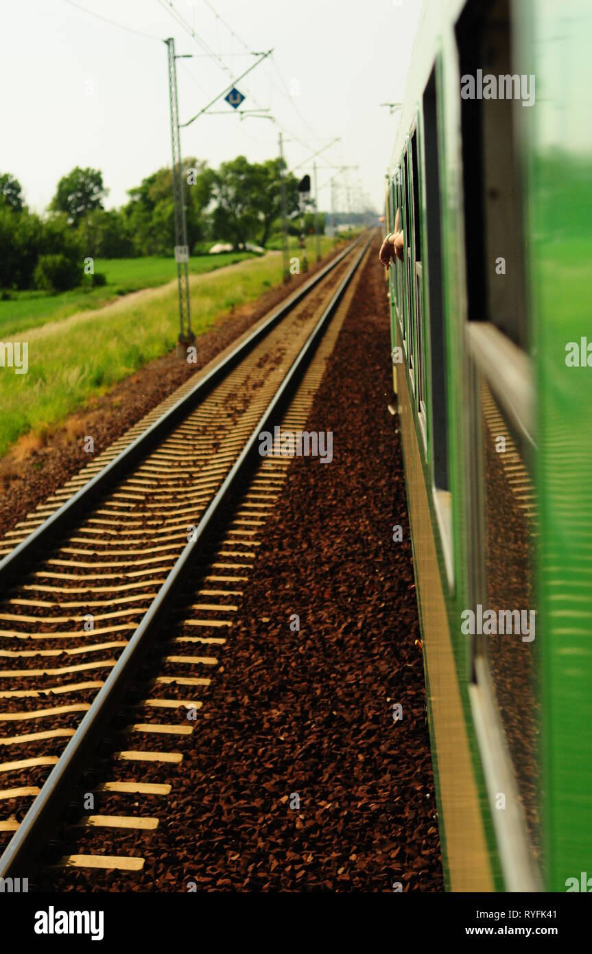 Long straight rail trucks seen from train Stock Photo - Alamy