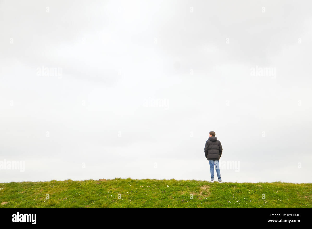 A single person standing on the horizon Stock Photo - Alamy