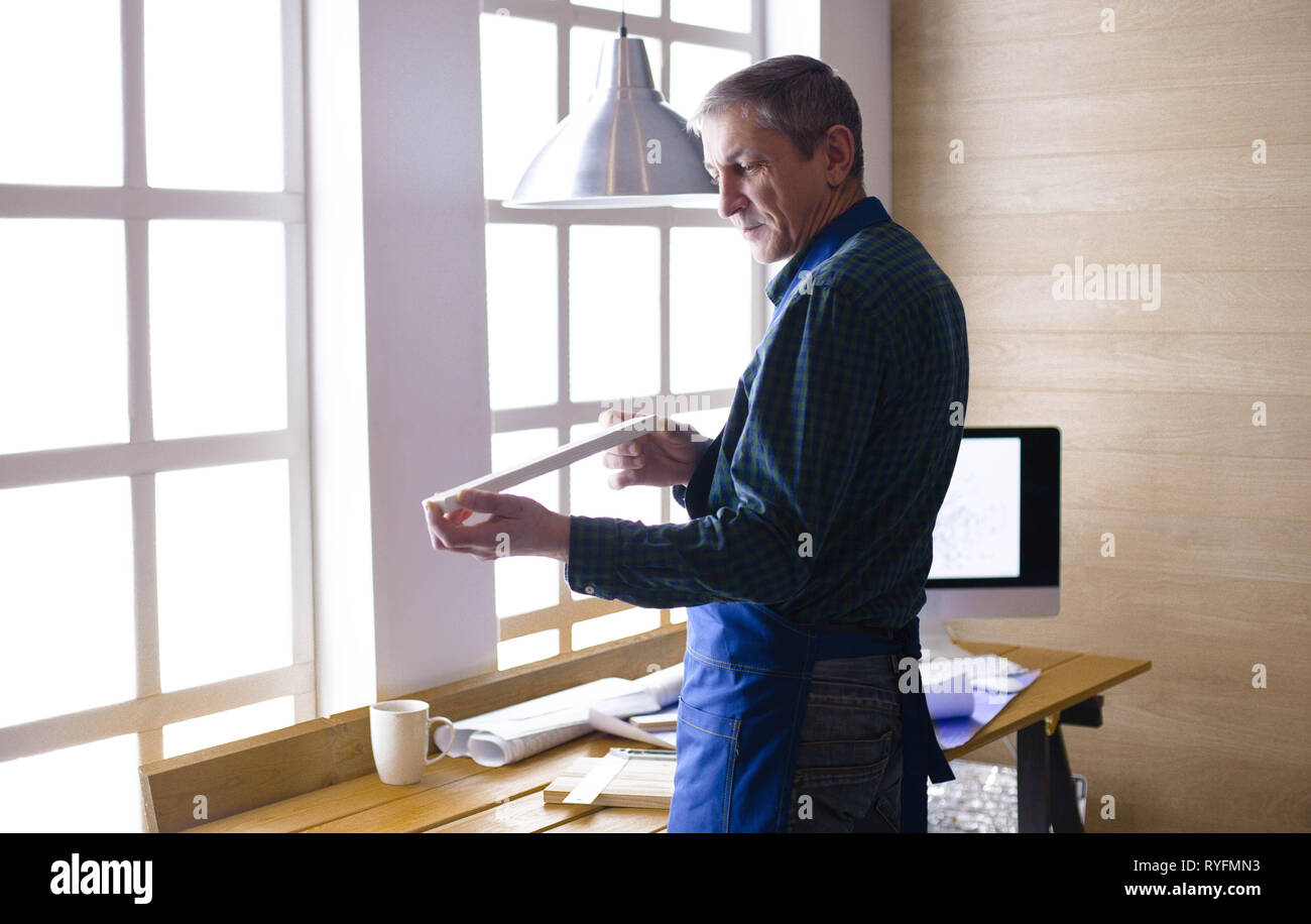 profession, carpentry, woodwork and people concept - carpenter testing ...