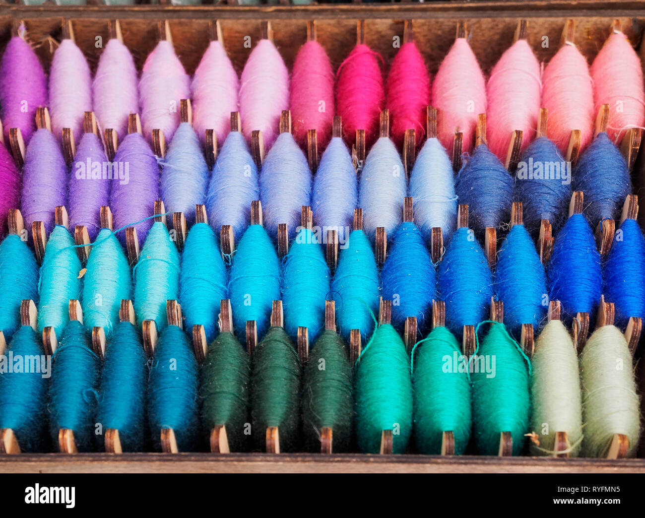 Close up colorful yarn texture background violet, magenta, purple ...