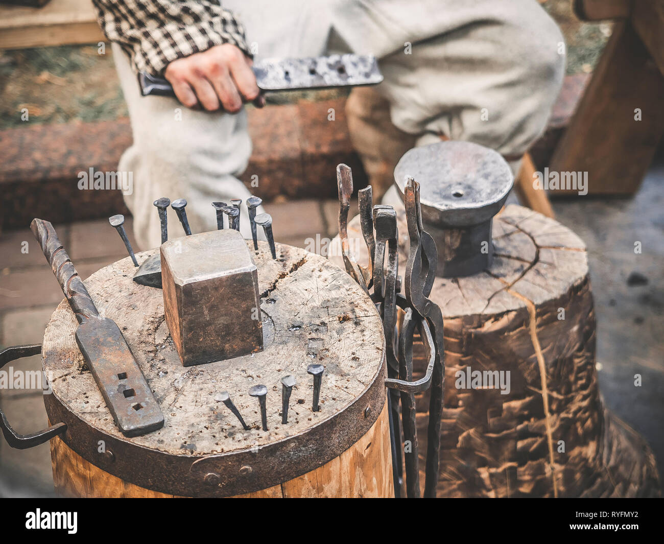 Metalworking tools of blacksmith. The hammer and the anvil and other ...