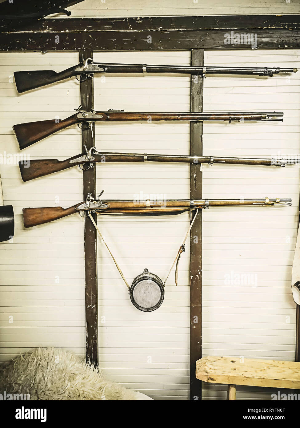 Old service rifles of British military with powder flask hanging on ...