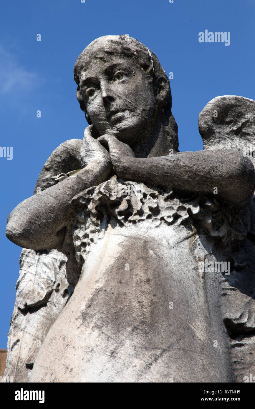 Statue / monument of an angel a grave stone in the Cimitero Monumentale ...