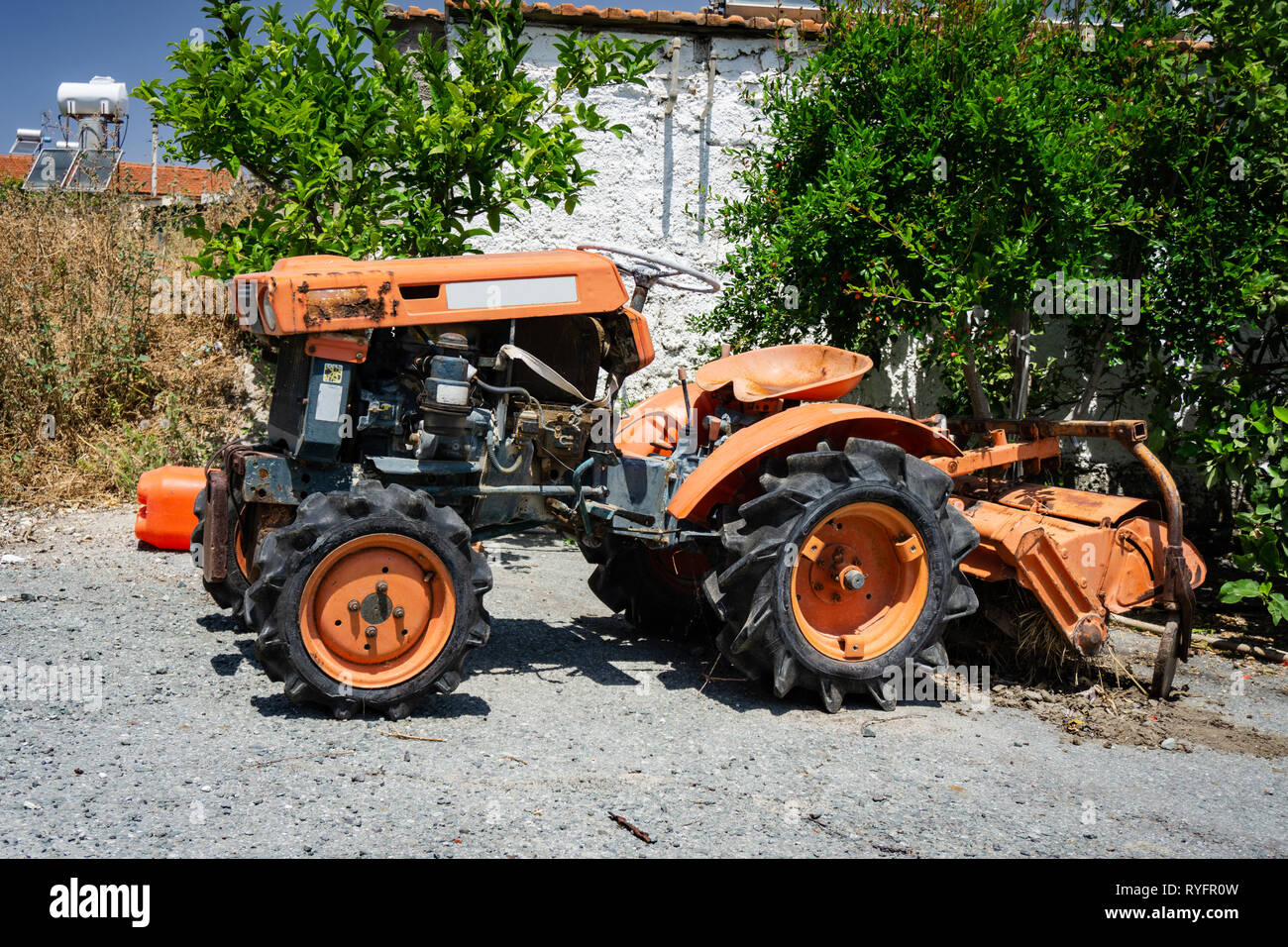Old agricultural tractor Stock Photo - Alamy