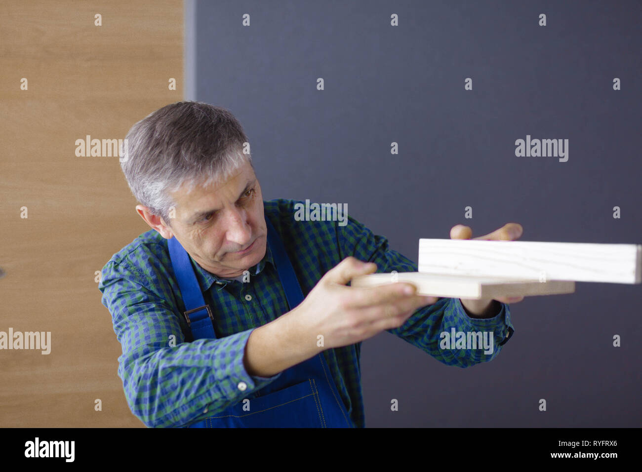 profession, carpentry, woodwork and people concept - carpenter testing ...