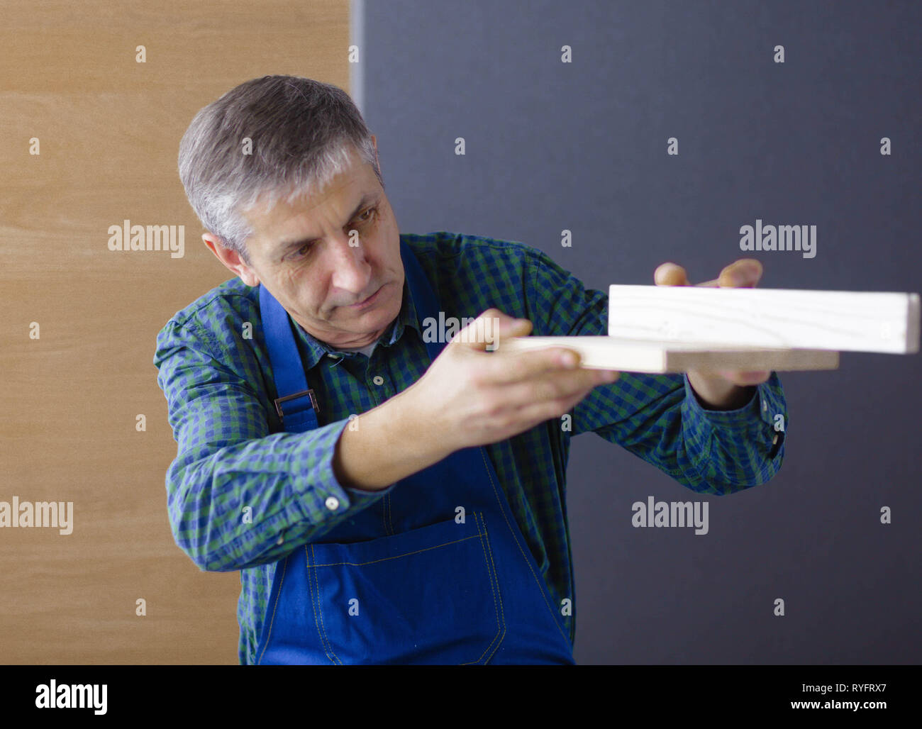 profession, carpentry, woodwork and people concept - carpenter testing ...