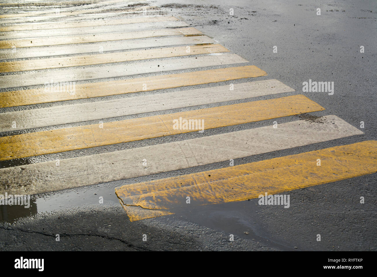 Damaged ashpalt and dirty zebra crossing, outdoor closeup Stock Photo ...