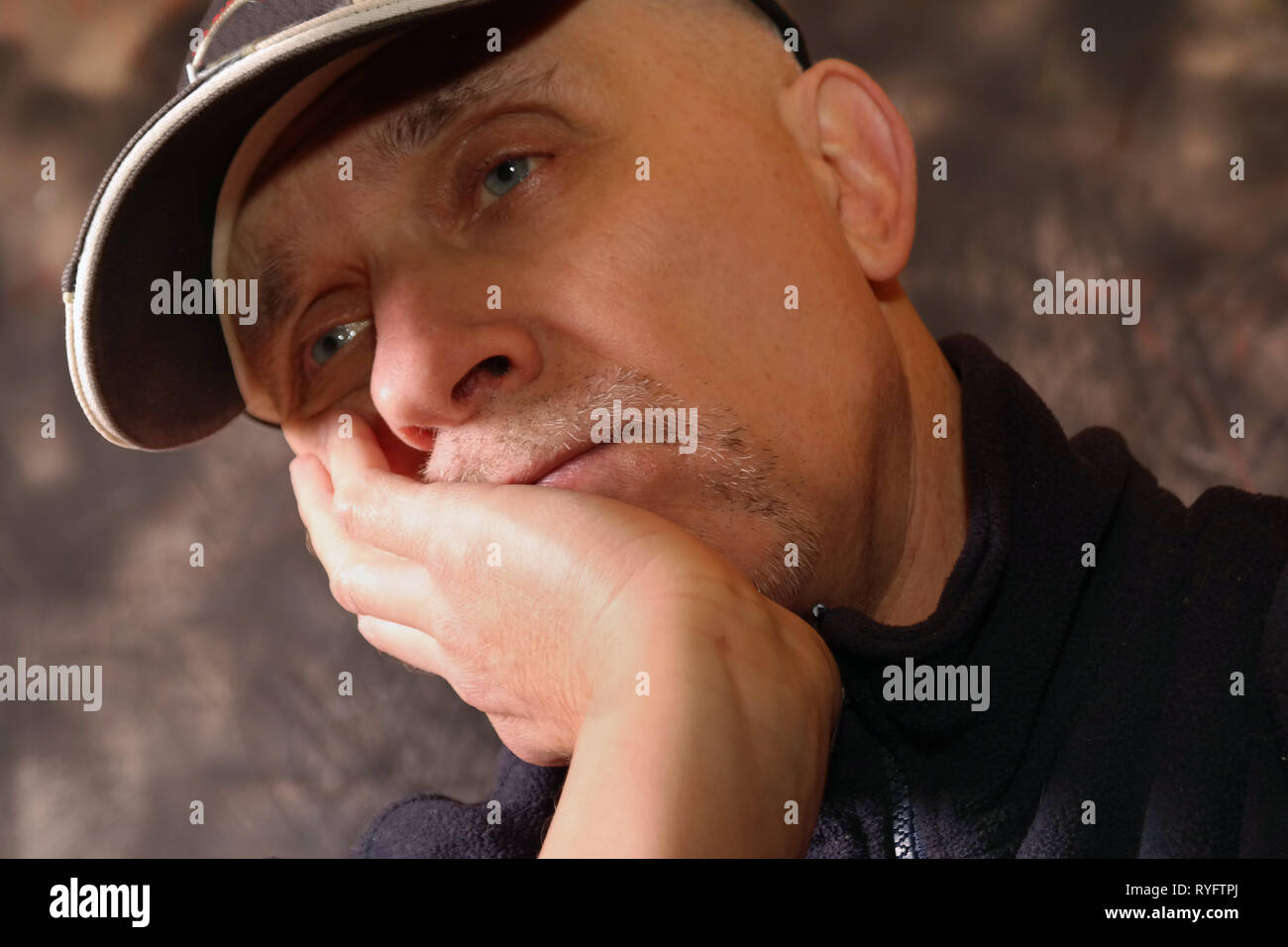 man feeling sad. studio head and shoulders portrait Stock Photo - Alamy