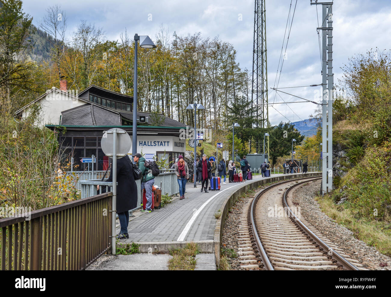Hallstatt, Austria - Oct 25, 2018. Passengers waiting at train station ...