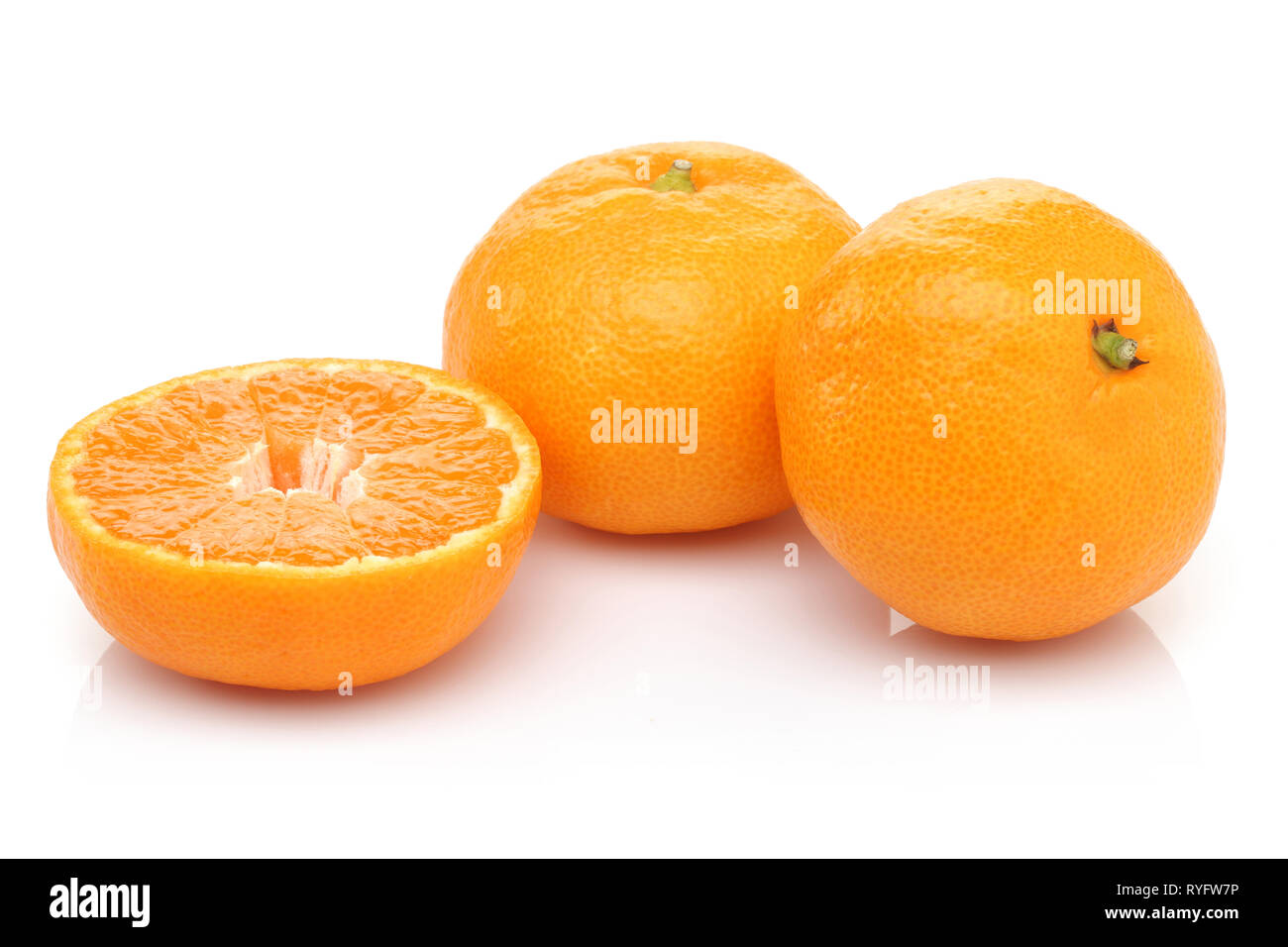 Group of whole and half mandarin fruits isolated on white background ...