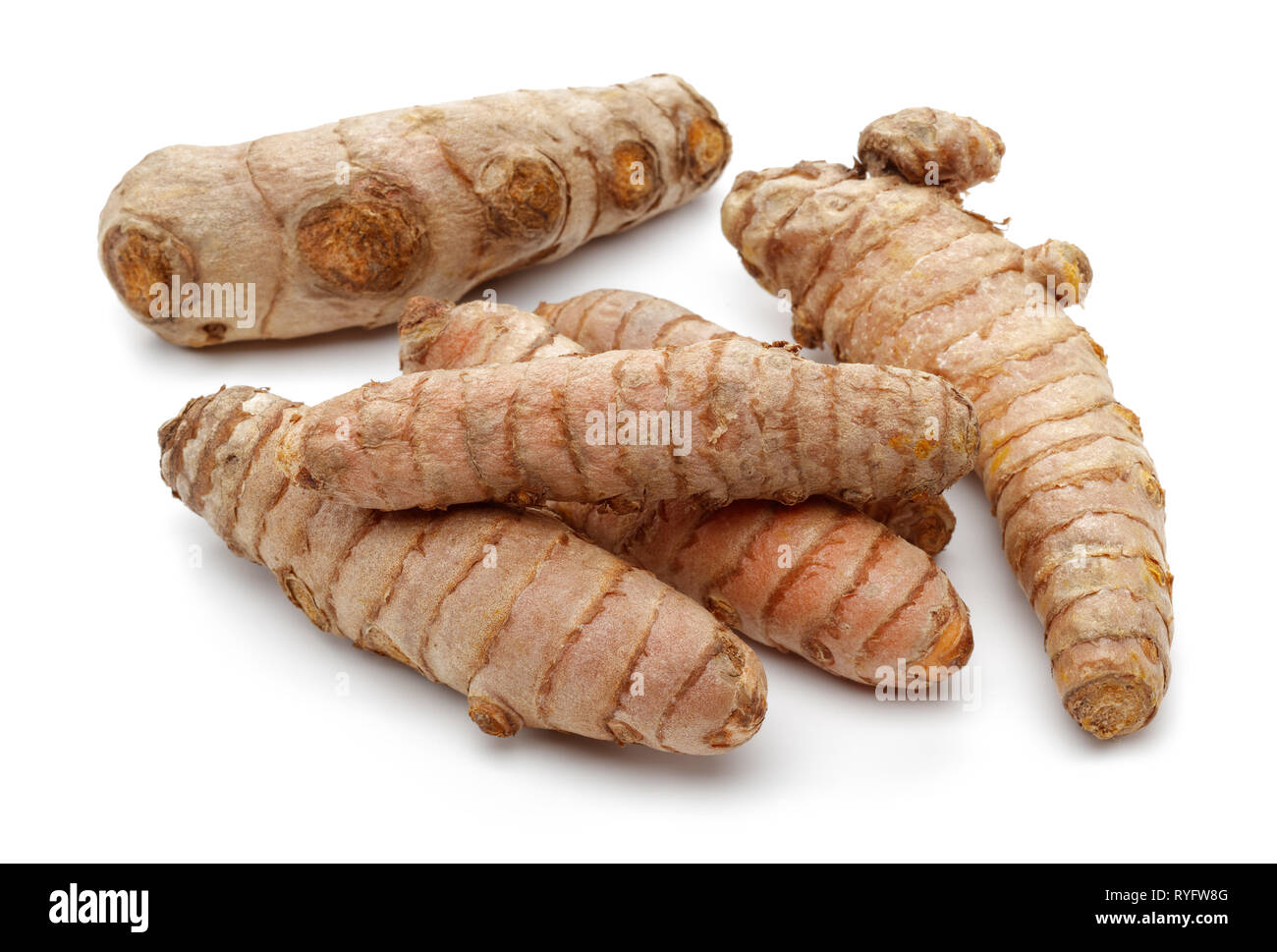 Fresh whole turmeric roots isolated on white background Stock Photo - Alamy