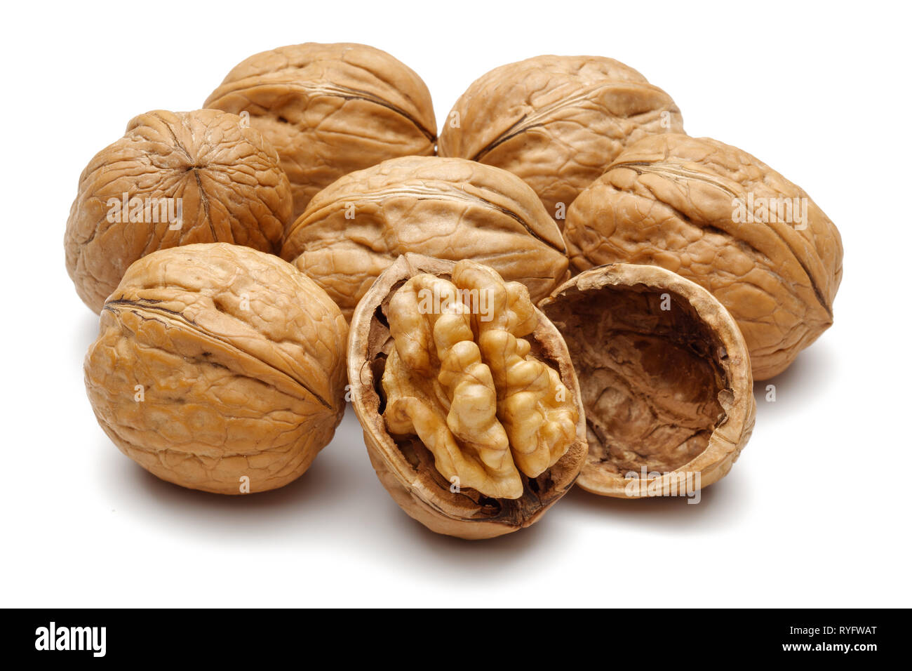 Whole and cracked walnuts isolated on white background Stock Photo - Alamy