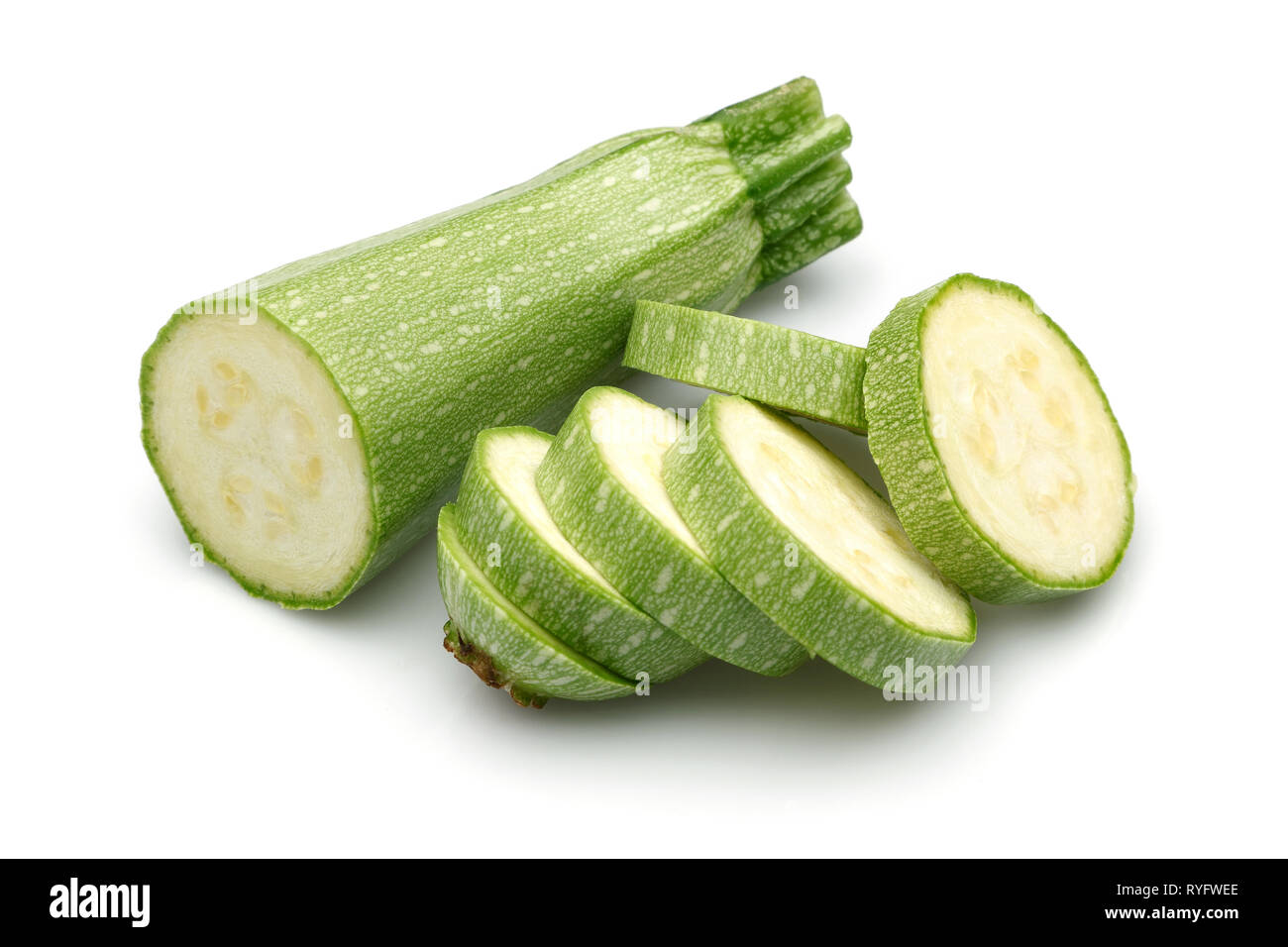 Sliced green zucchini isolated on white background Stock Photo - Alamy