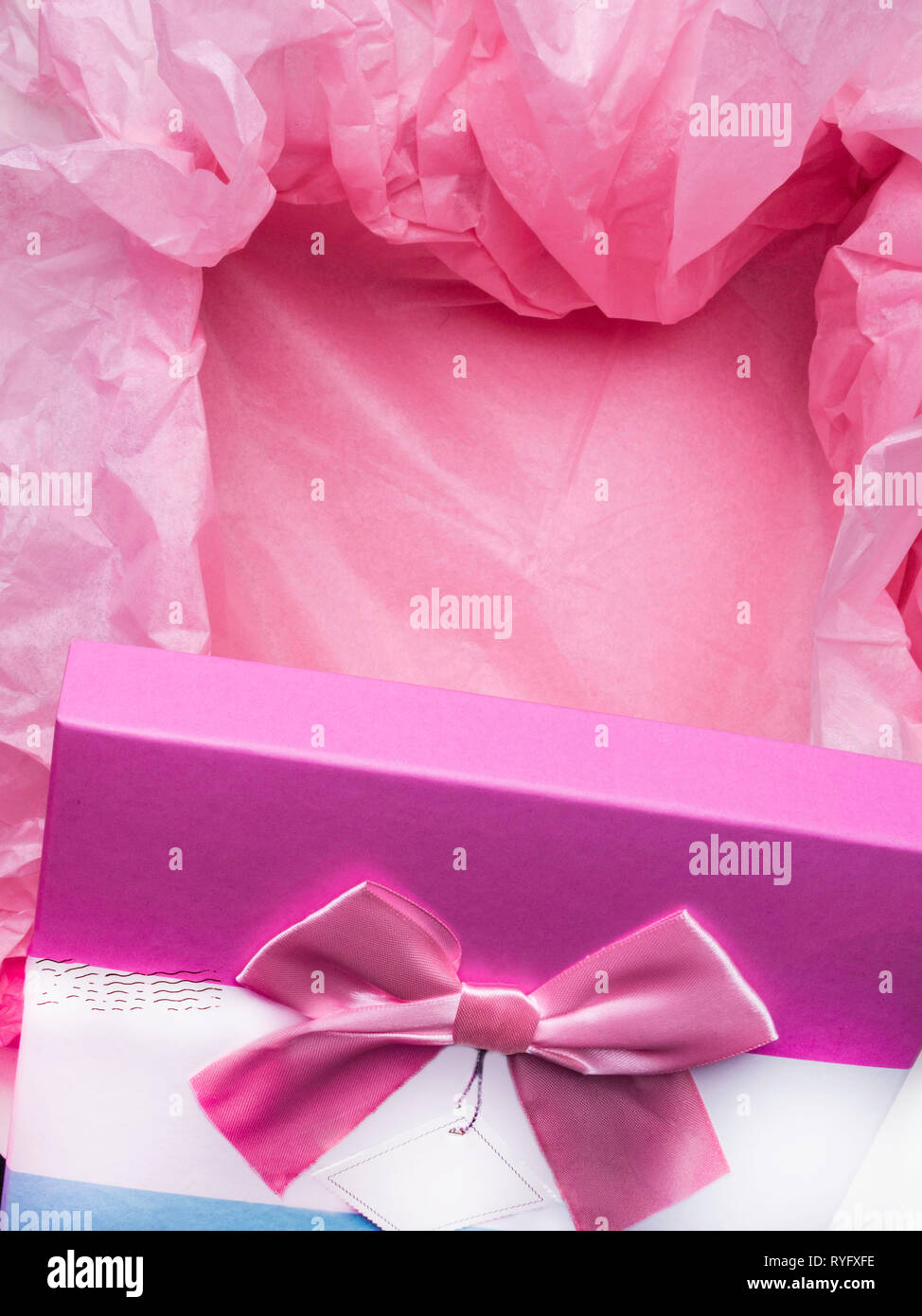 Pink open gift box background with satin bow Stock Photo - Alamy