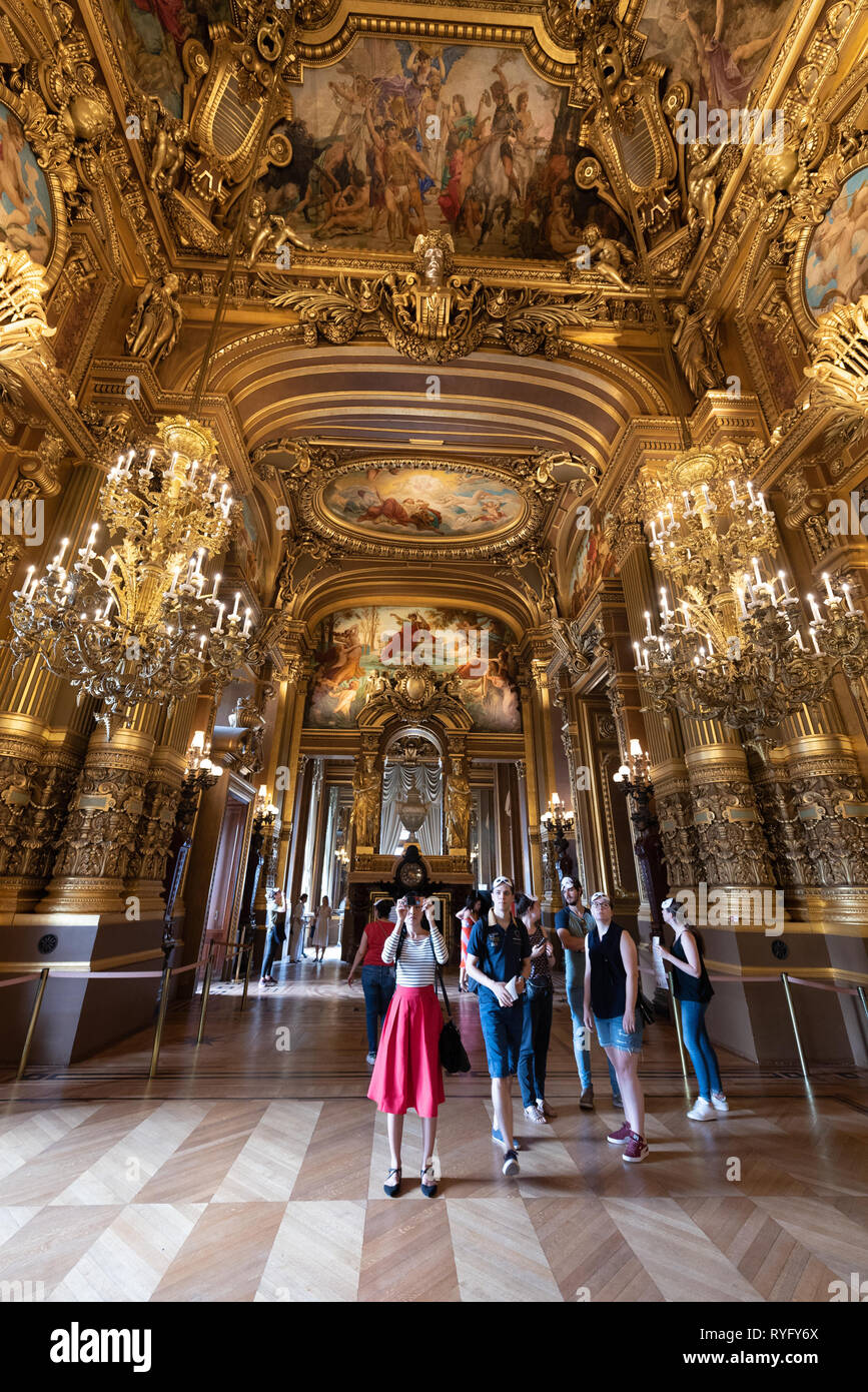Paris (France): tourists visiting Palais Opera. The Grand Foyer (hall ...