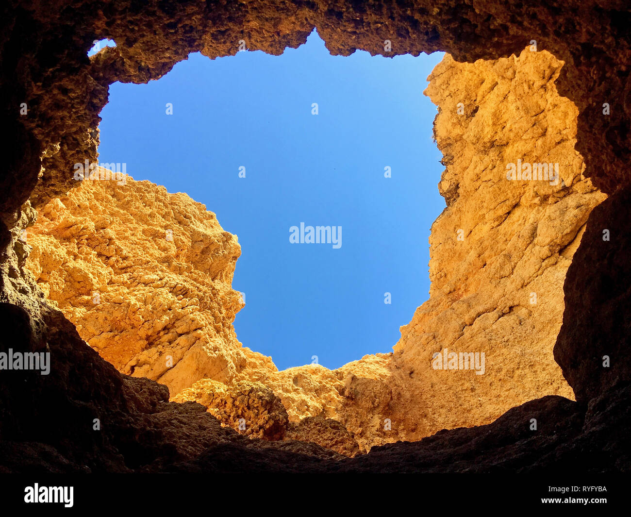 Natural window in sea cliffs, Algarve, Portugal Stock Photo - Alamy