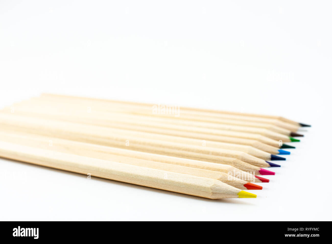 Wood colored pencils isolated on white background Stock Photo - Alamy