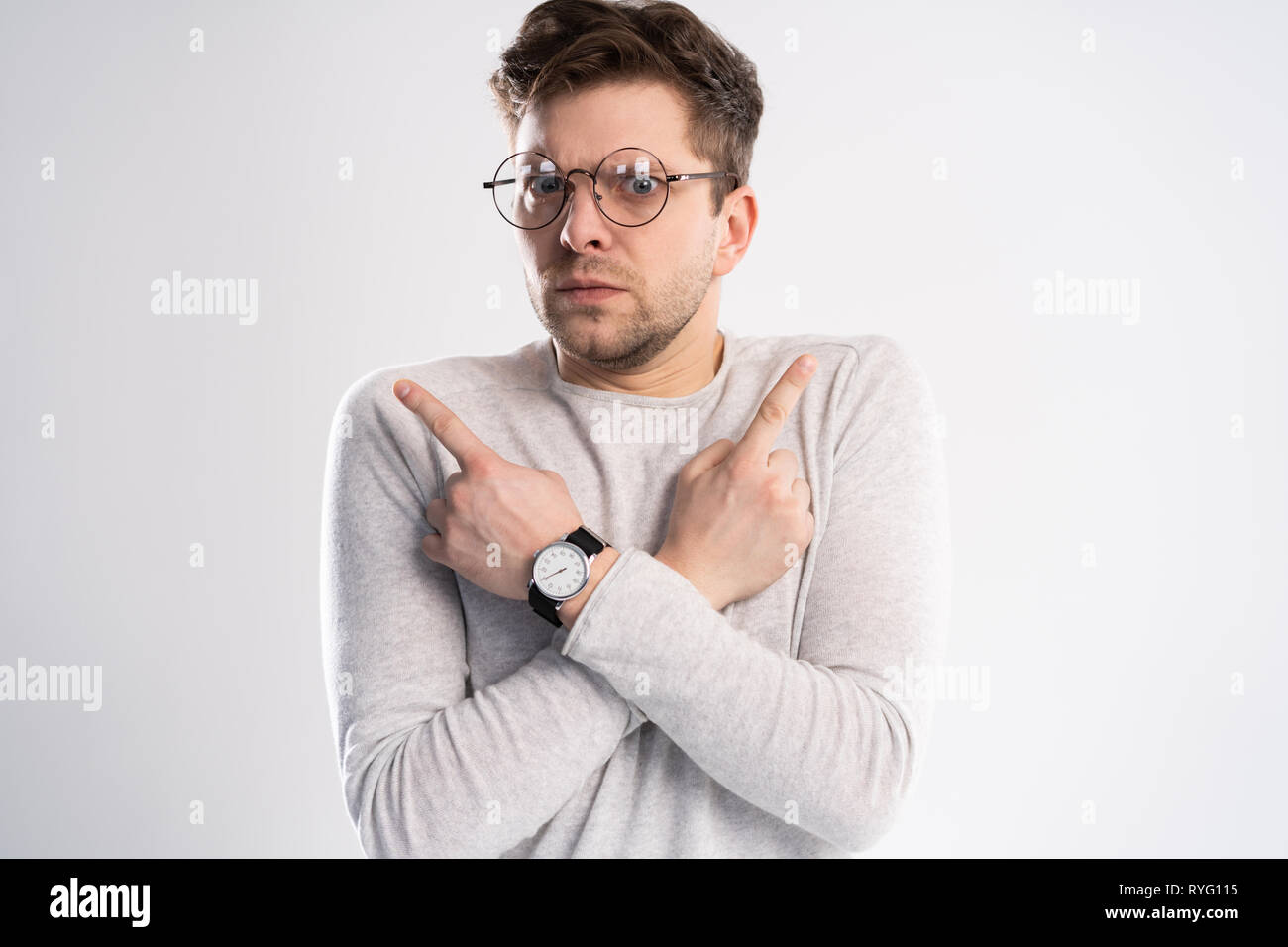 Young emotional careless man isolated on white background with copy ...
