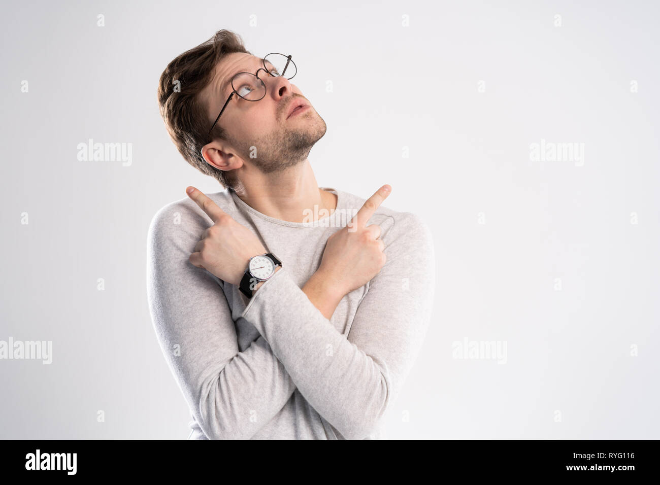 Young emotional careless man isolated on white background with copy ...
