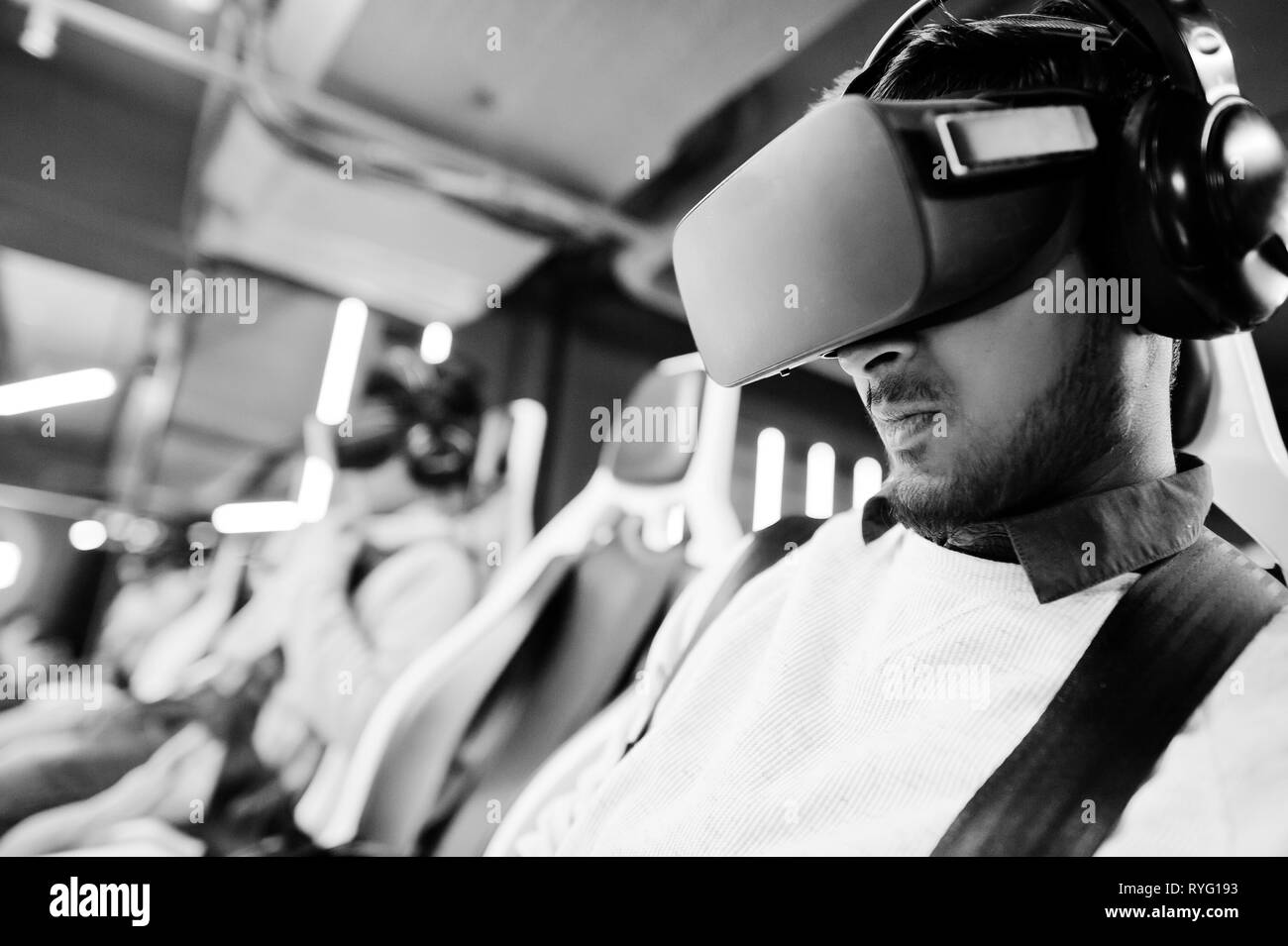 Two young indian people having fun with a new technology of a vr ...