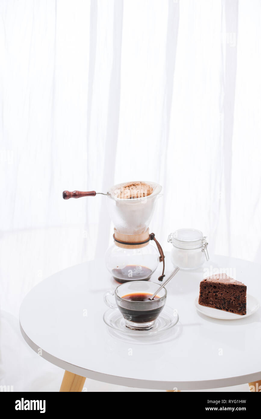 Drip coffee (dripper) and drip ground coffee with glass drip pot, cup ...