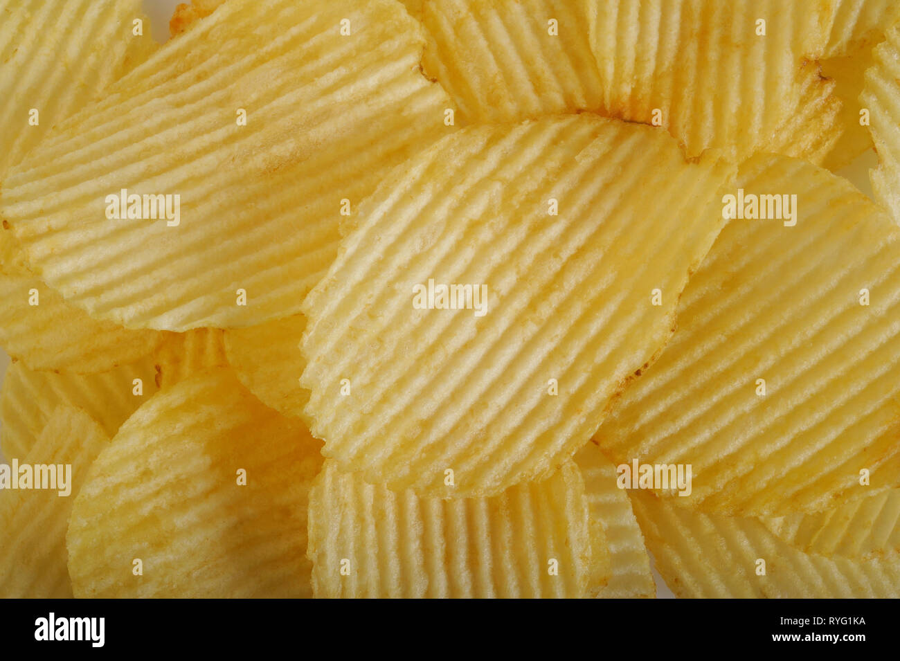 Potato chips background Stock Photo - Alamy