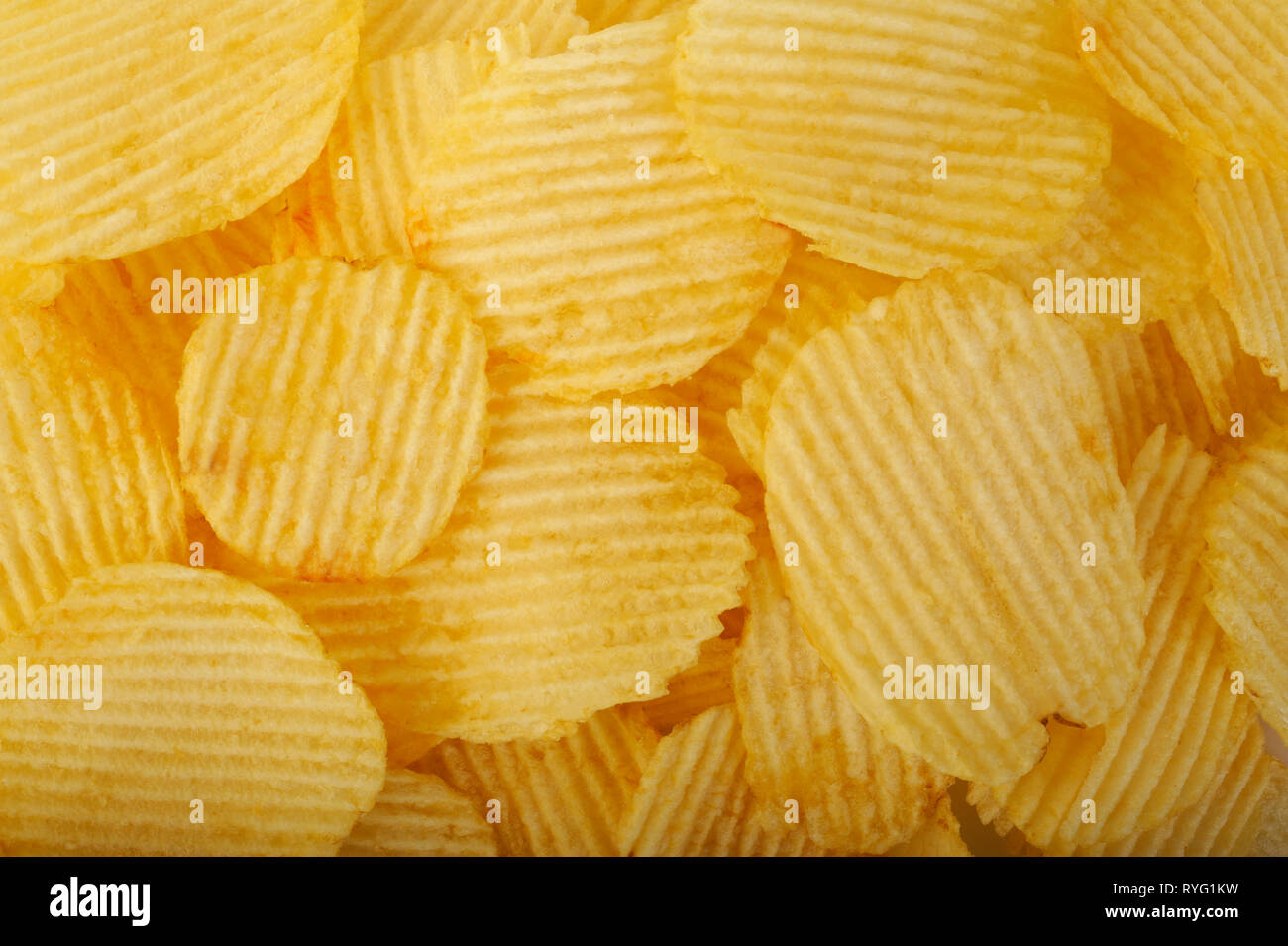 Potato chips background Stock Photo - Alamy