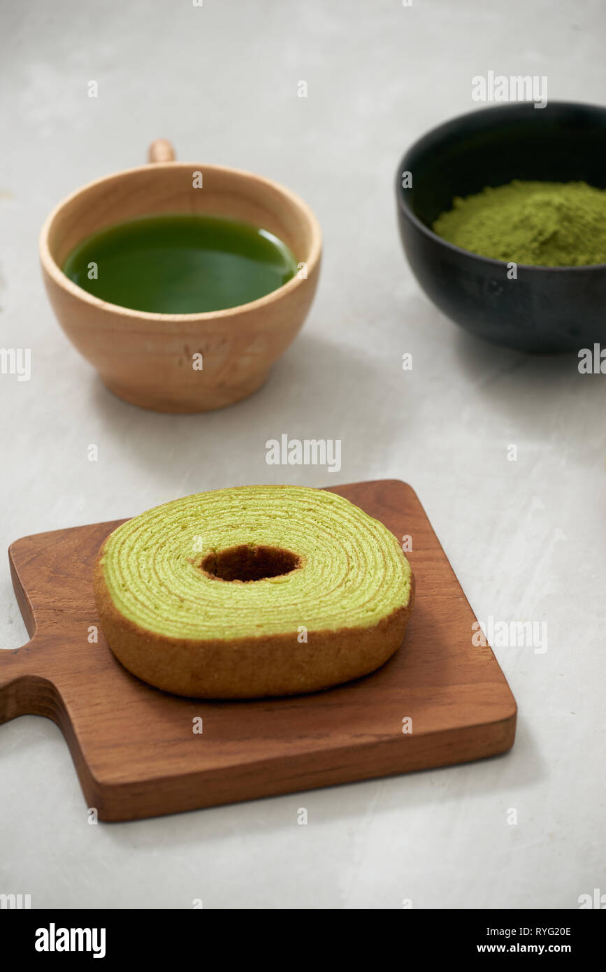 German cake, Green tea Baumkuchen with latte Stock Photo - Alamy