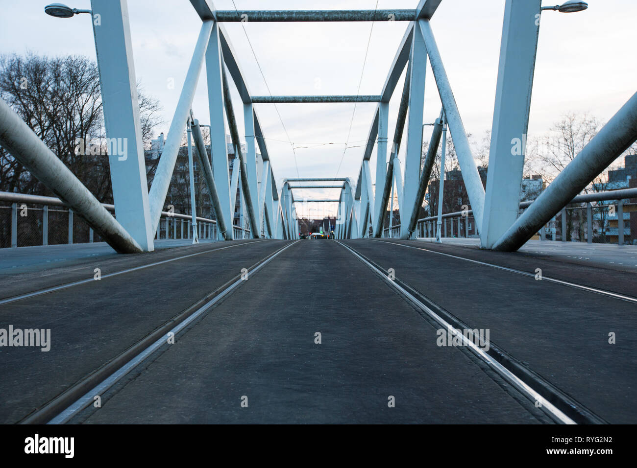 Modern railroad bridge crossing the river, evening time background in ...