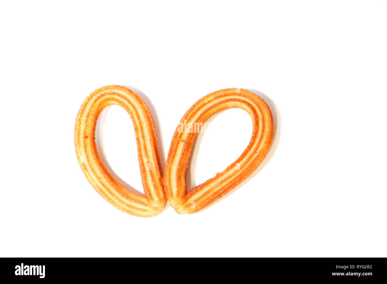 two spanish fritters on white background Stock Photo - Alamy