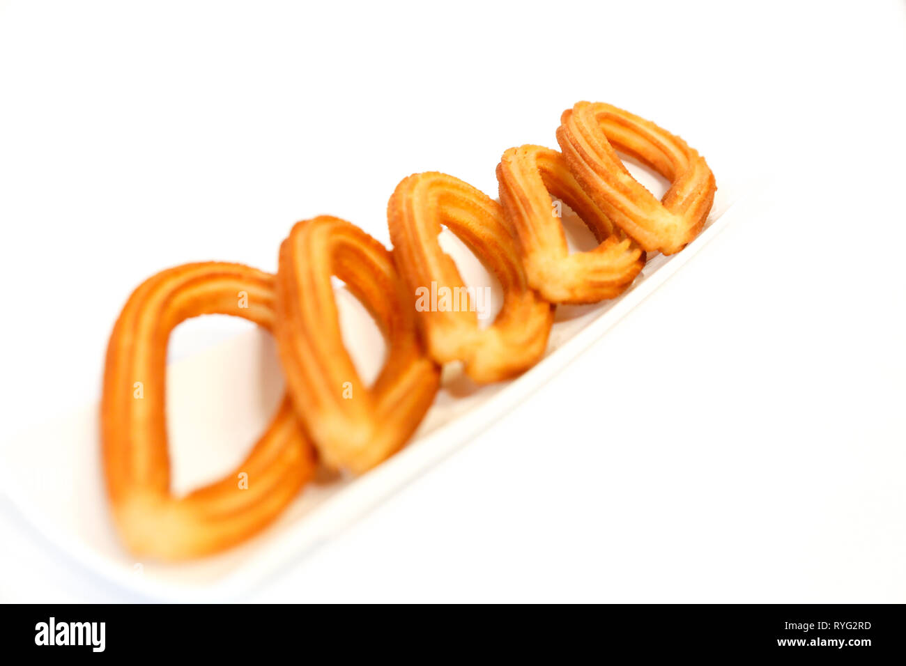 spanish fritters on white background Stock Photo - Alamy