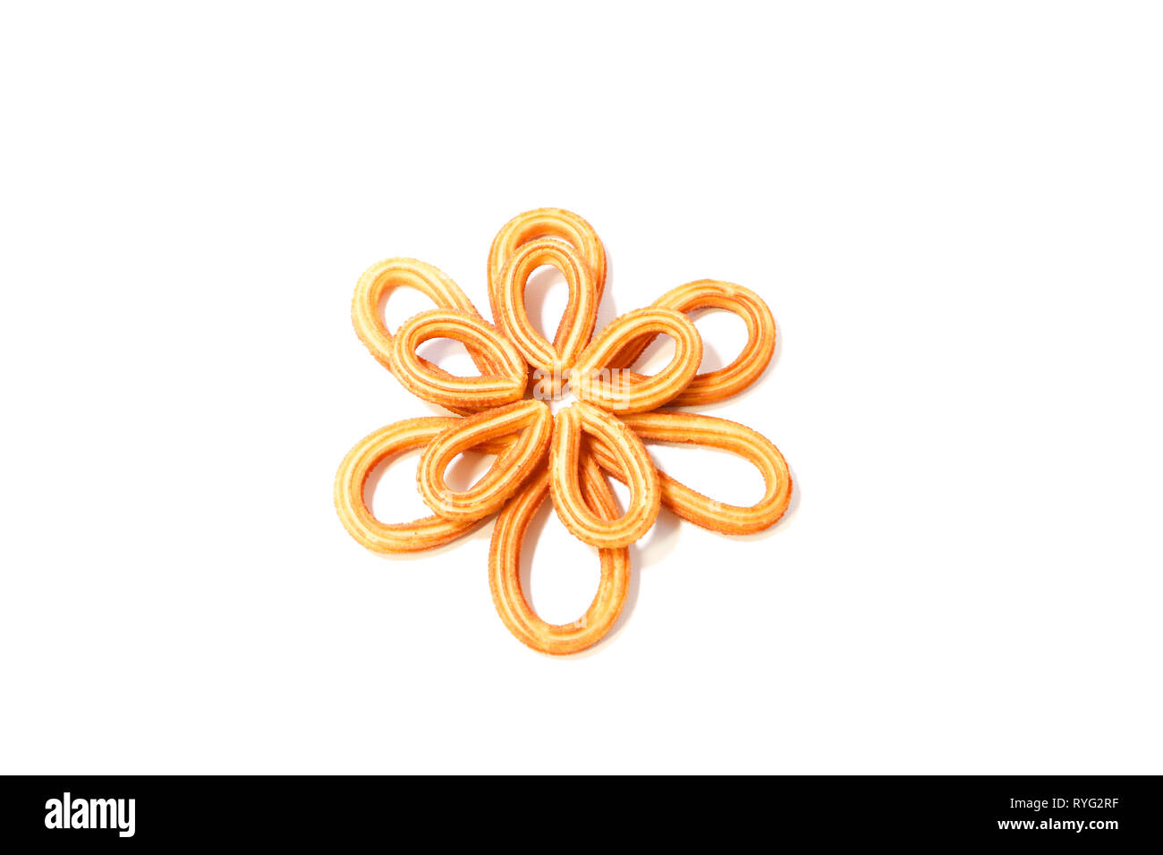 spanish fritters in flower shape on white background Stock Photo - Alamy