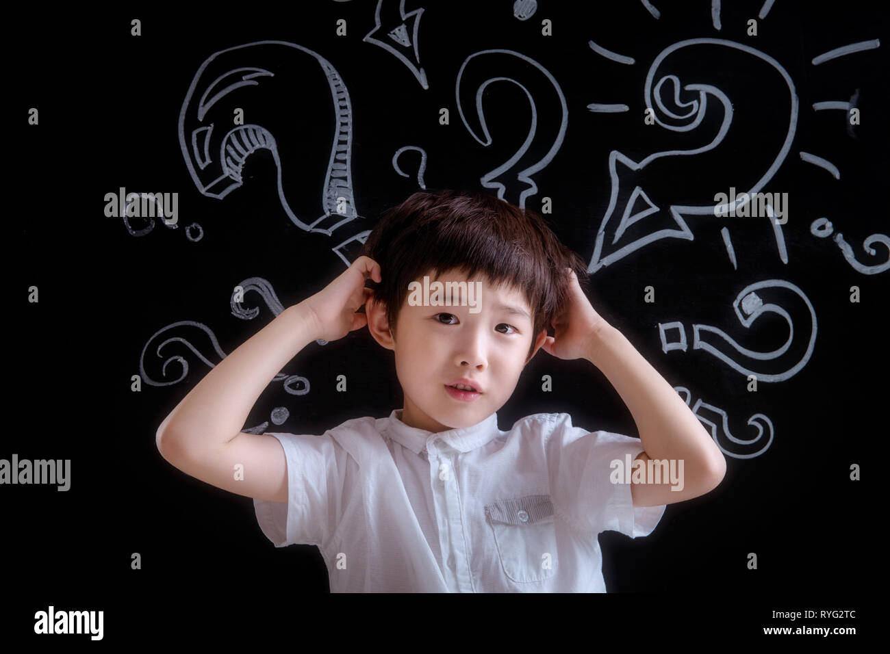 Primary school boy in thinking Stock Photo - Alamy