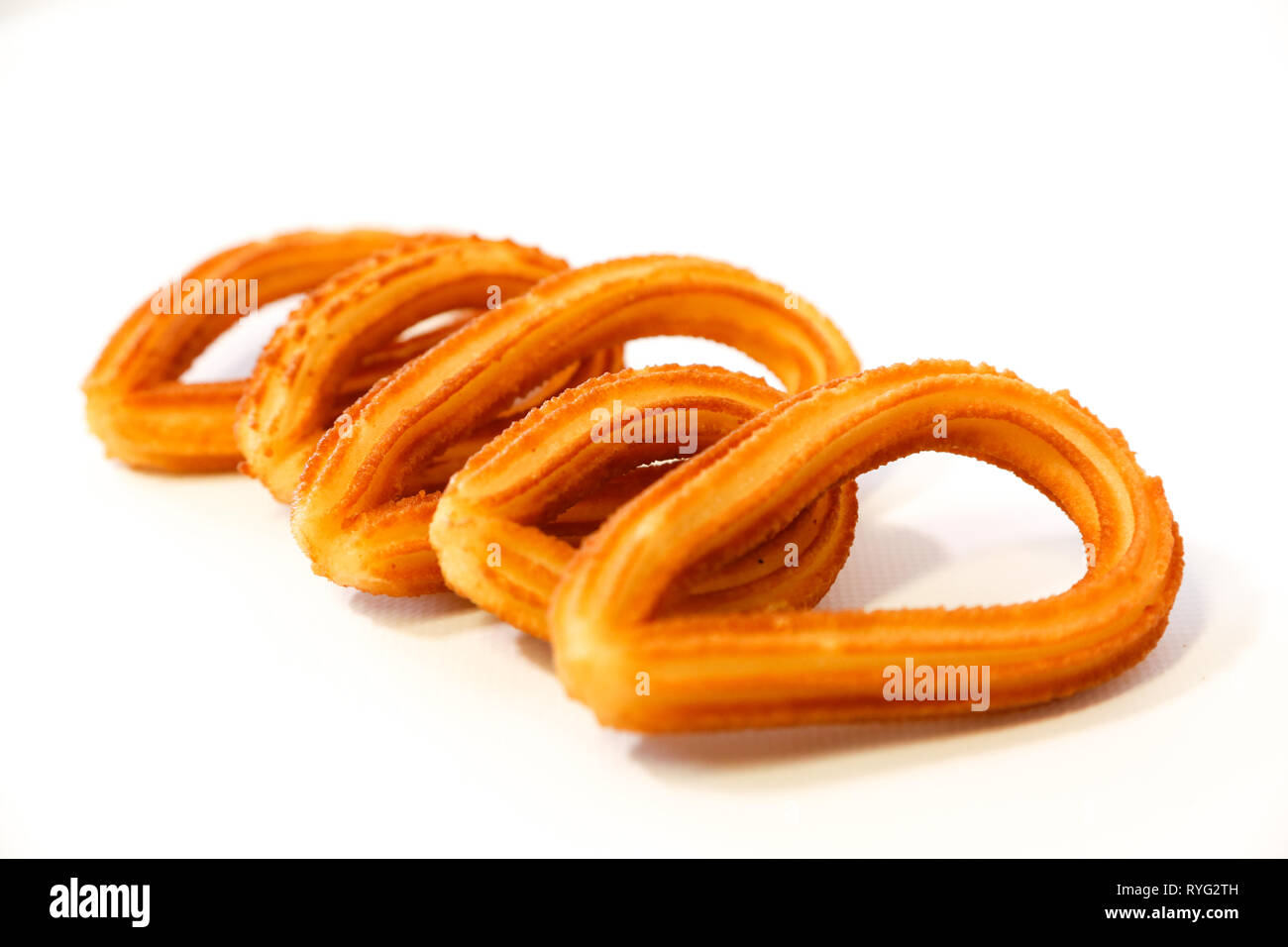 spanish fritters on white background Stock Photo - Alamy