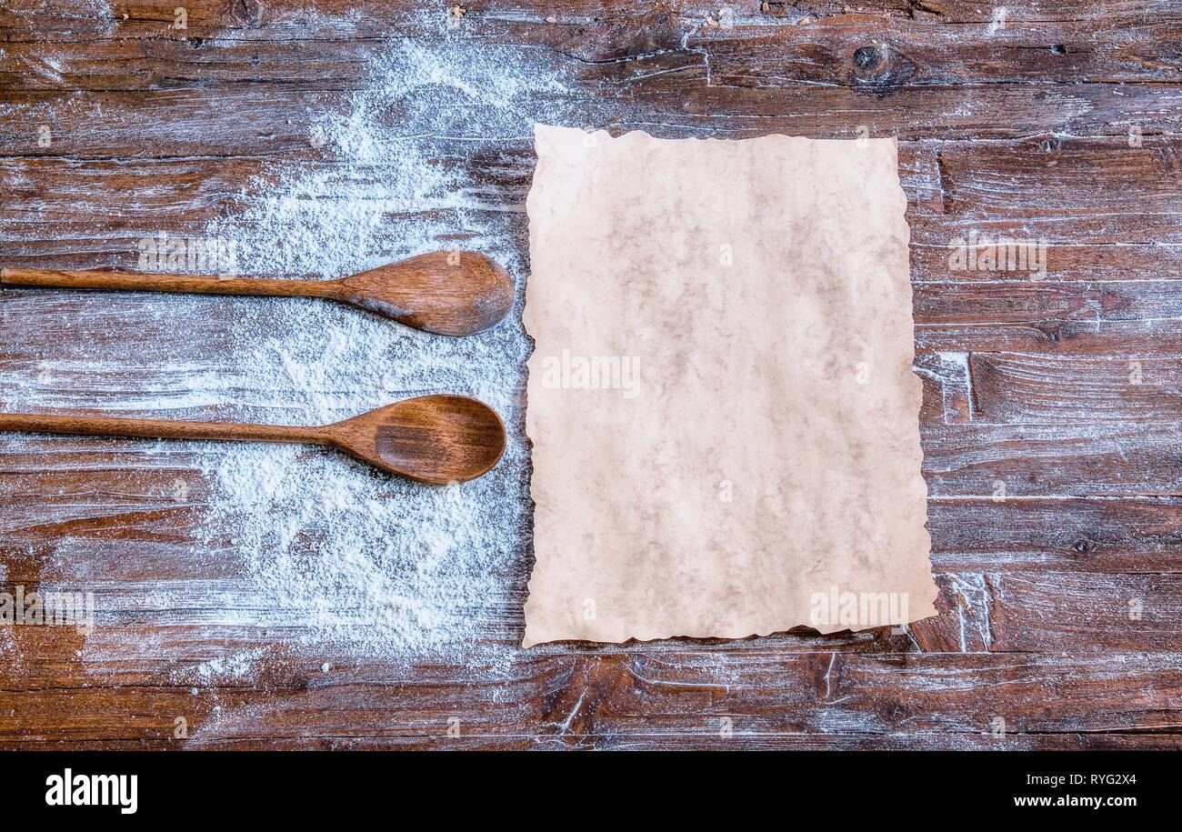 Blank cookbook with some ingredients on the wooden table, top view ...