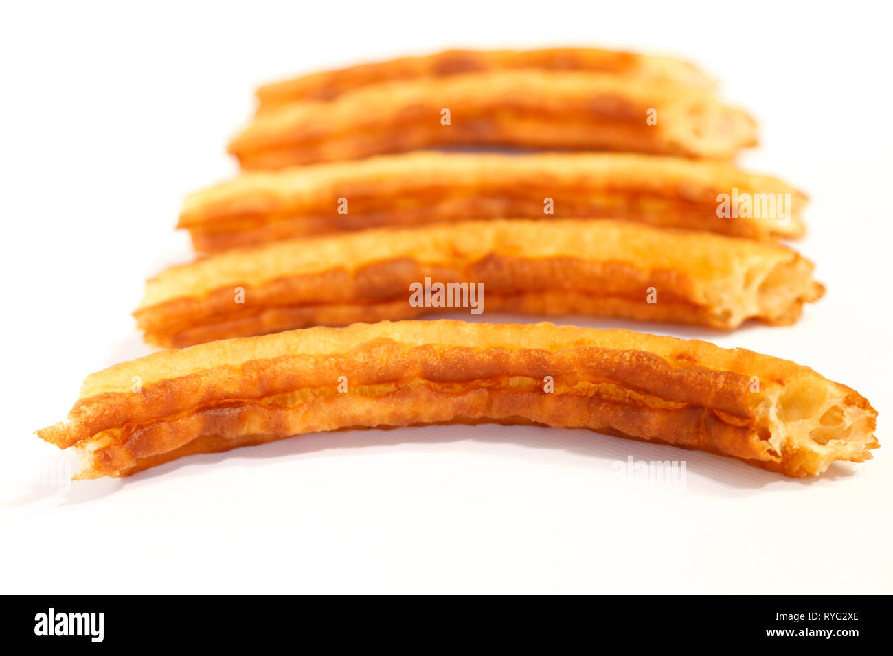spanish fritters on white background Stock Photo - Alamy