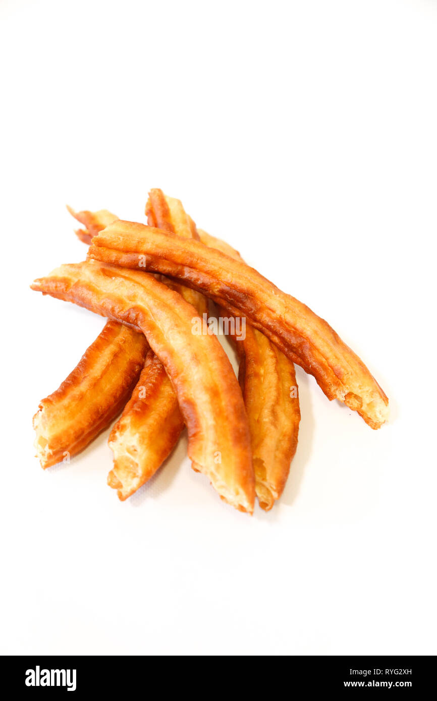 spanish fritters on white background Stock Photo - Alamy