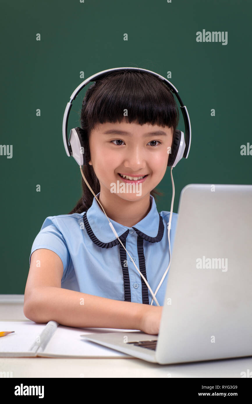 Primary school girls online learning Stock Photo - Alamy
