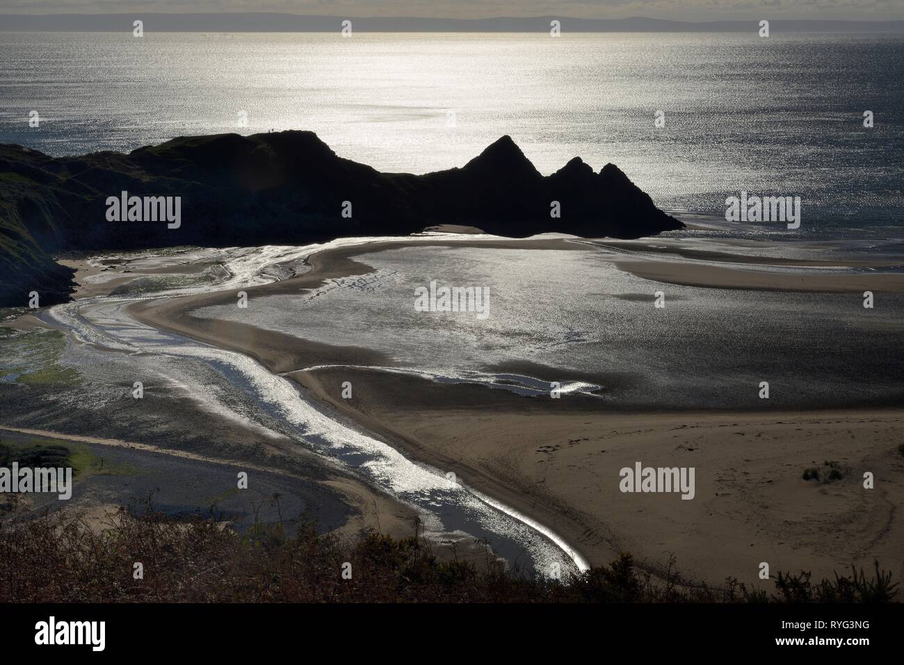 Overview of Three Cliffs Bay with Pennard Pill stream flowing across ...
