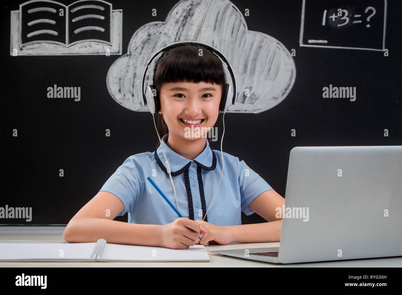 Primary school girls online learning Stock Photo - Alamy