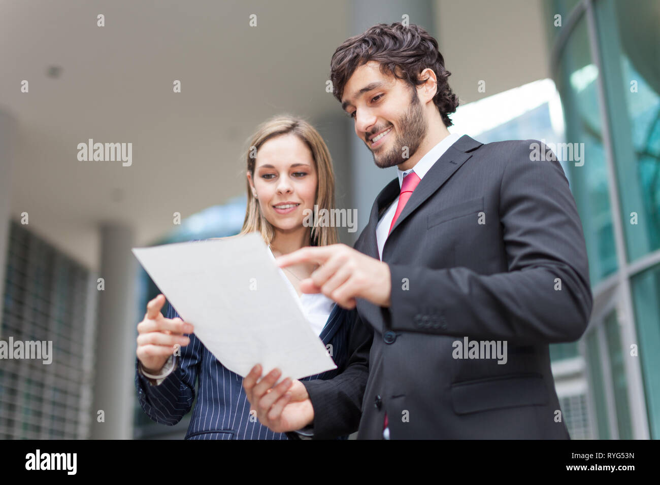 Business people reading some documents Stock Photo - Alamy