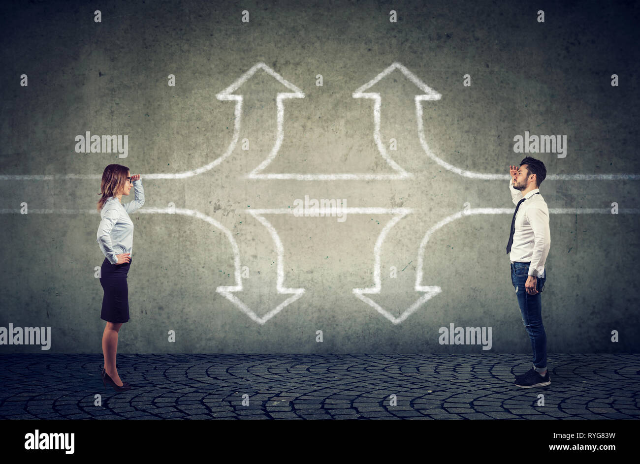 Confident businesswoman and businessman looking into the future as a ...