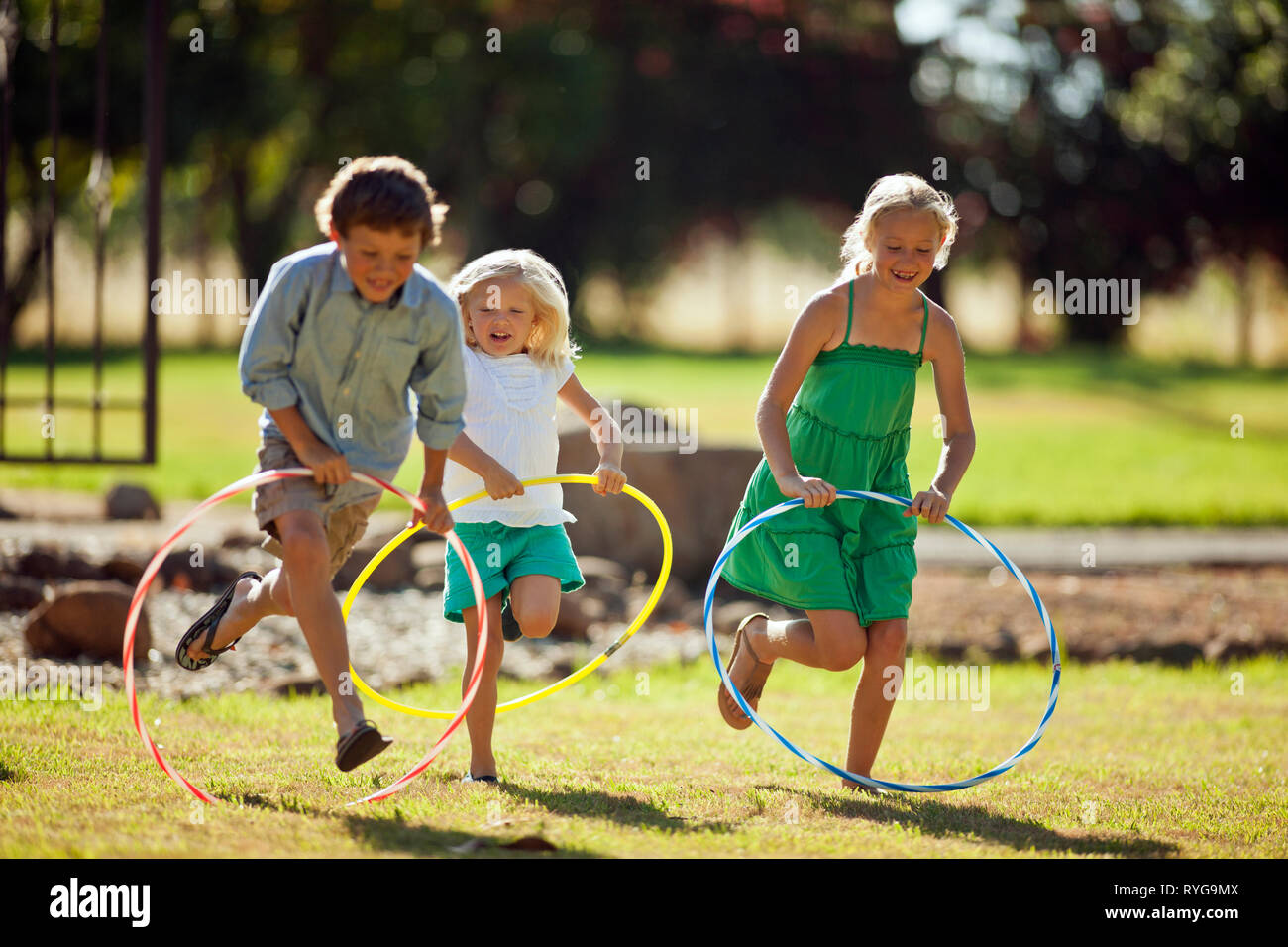 Children playing hula hoops hi-res stock photography and images - Alamy