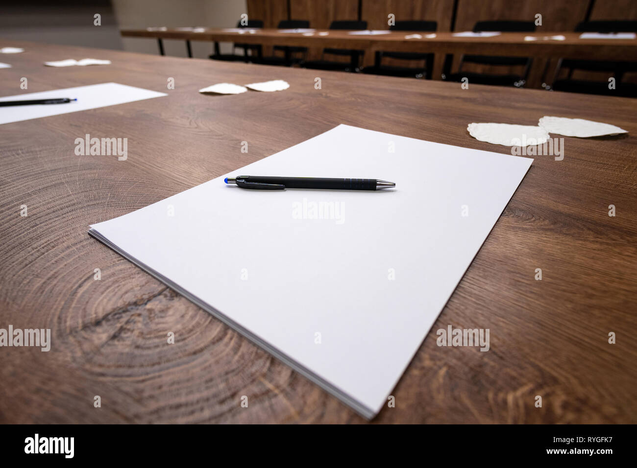 Paper on a conference table hi-res stock photography and images - Alamy