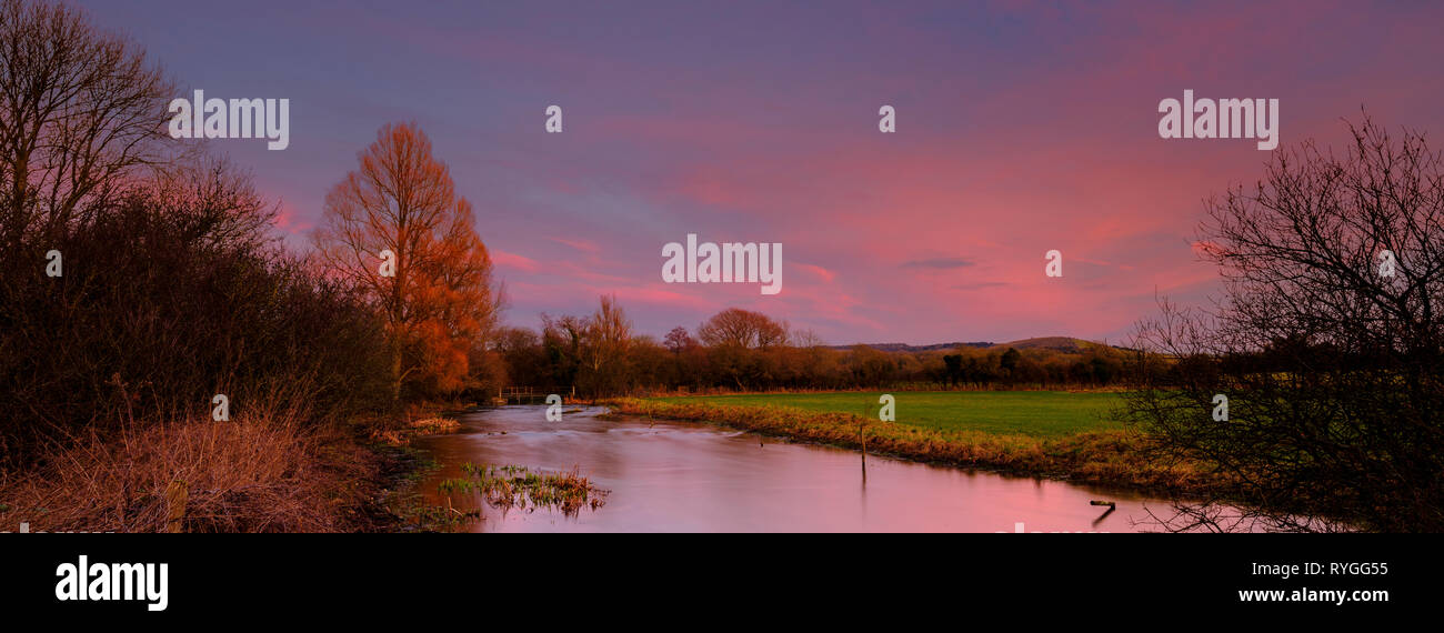 The River Meon at sunset with Old Winchester Hill, Exton, Hampshire, UK ...