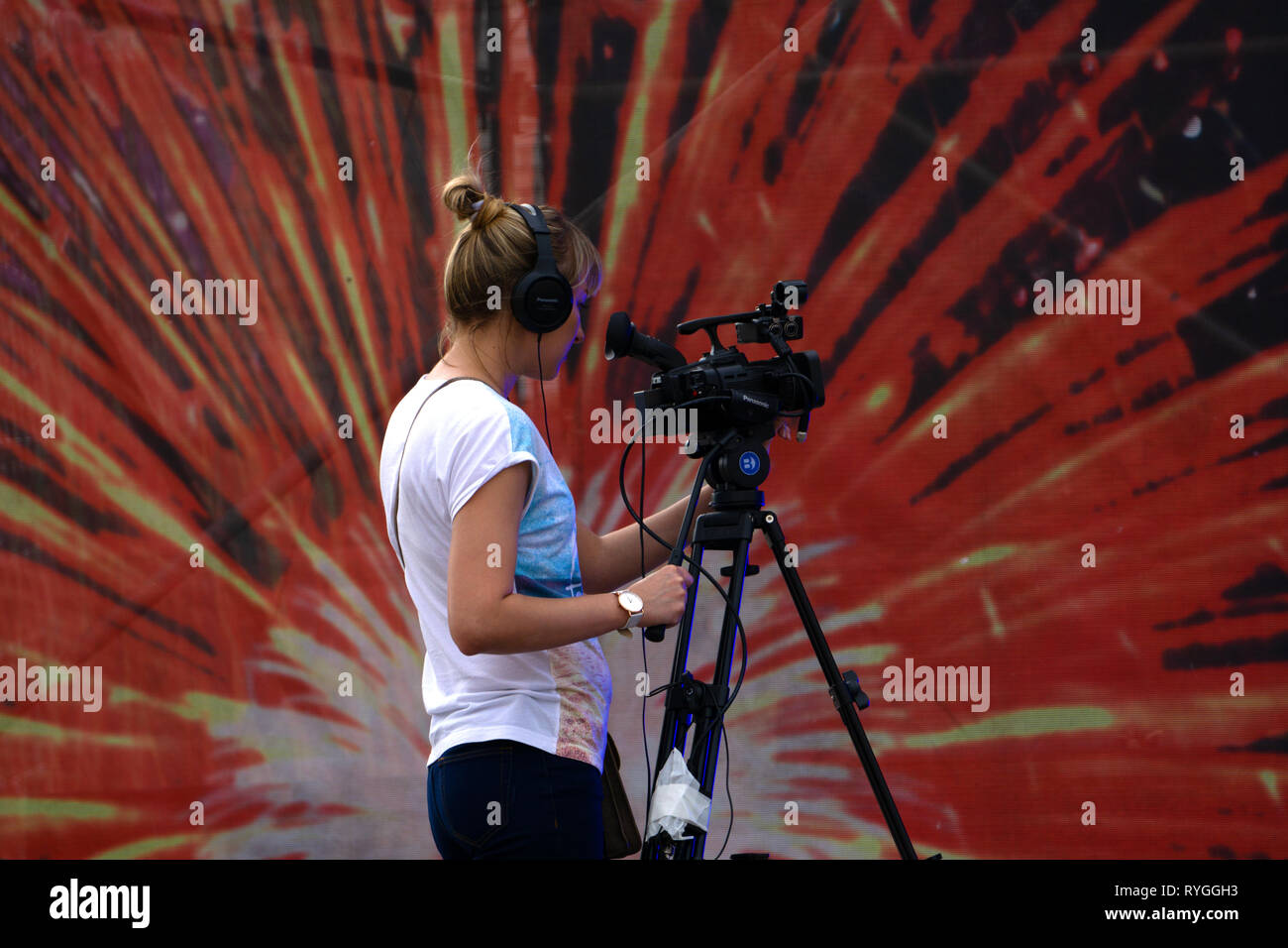 Video camera man operator working with professional equipment,filming ...