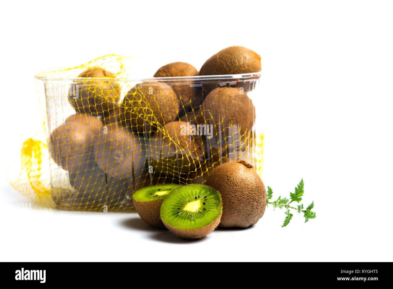 Kiwi fruit in a box isolated on white Stock Photo - Alamy