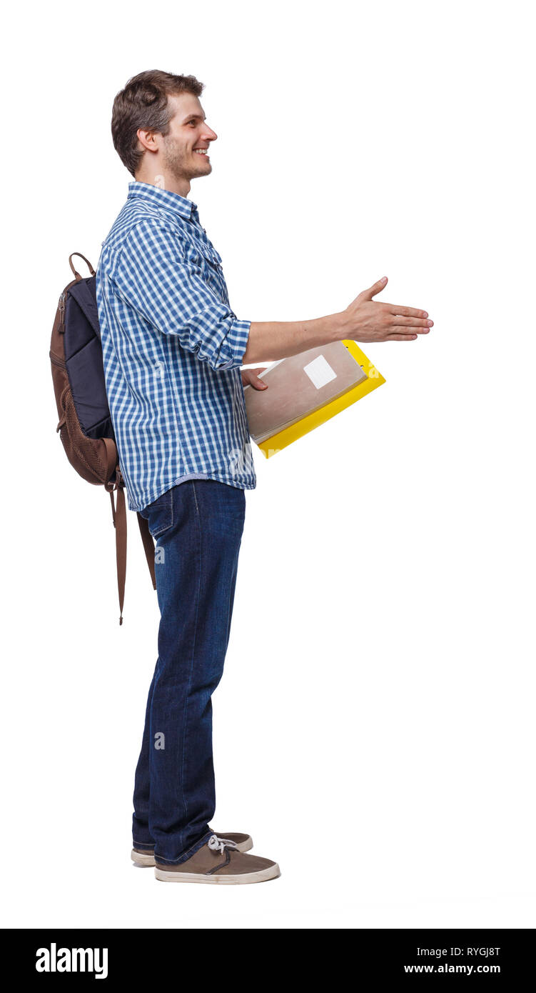 Side view of student man with the backpack and textbookswho stretches ...